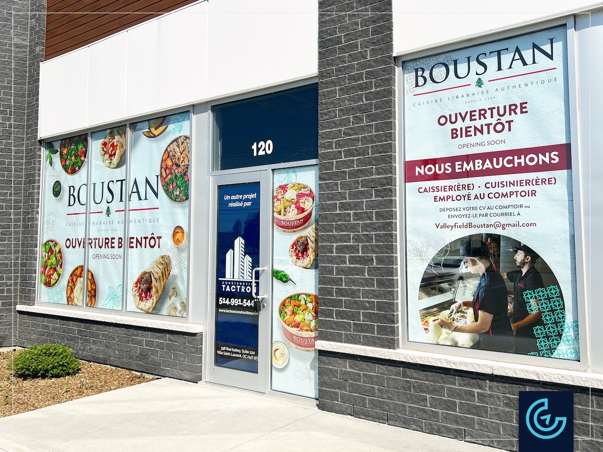 Temporary window graphics "Opening Soon" as construction palisade for ...