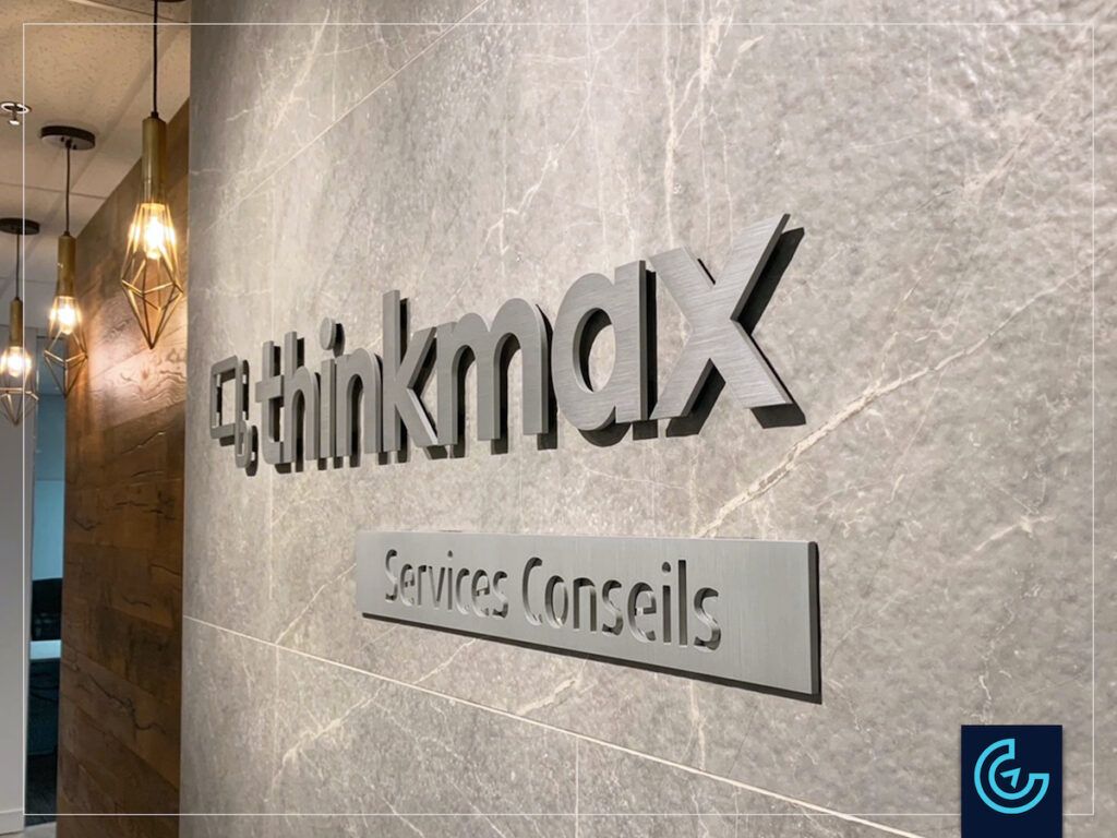 Company signature wall sign in cast metal letters with brushed ...