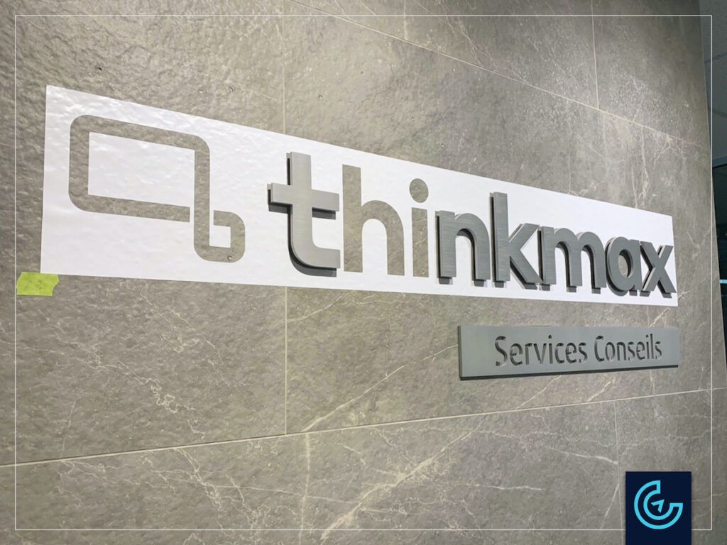 Company signature wall sign in cast metal letters with brushed ...